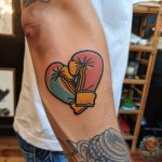 Unleashing the Power: Exploring the Symbolism of Boxing Gloves Tattoos ...