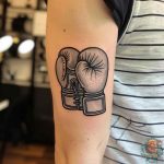 Unleashing the Power: Exploring the Symbolism of Boxing Gloves Tattoos ...