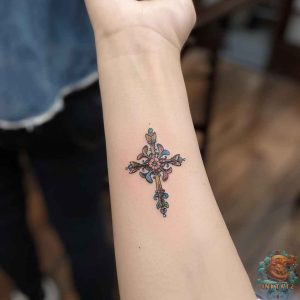 Unlocking the Meaning: The Intriguing World of Cross on Wrist Tattoos ...
